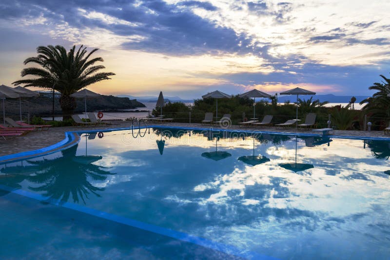 Sunset and swimming pool stock photo. Image of sand, paradise - 4164704