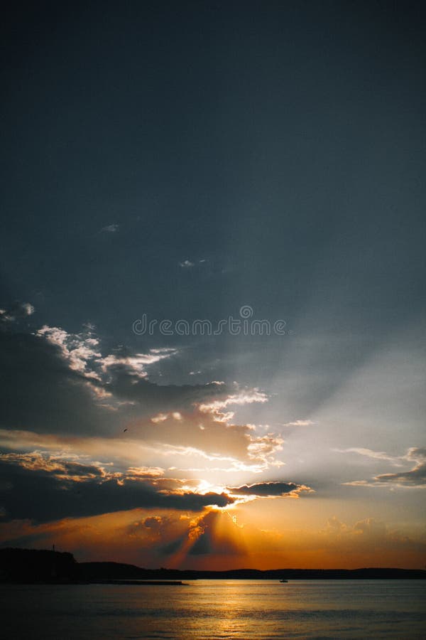 Beautiful Sun Behind the Clouds on the Sea Stock Photo - Image of gold ...