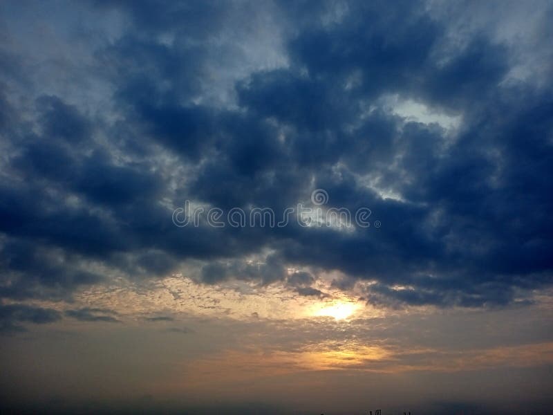 Beautiful Sun Coming Out of the Dark Clouds Stock Photo - Image of ...