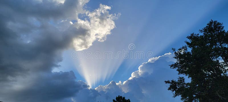Beautiful Sun Rays Across the Sky and Above the Clouds Stock Photo ...