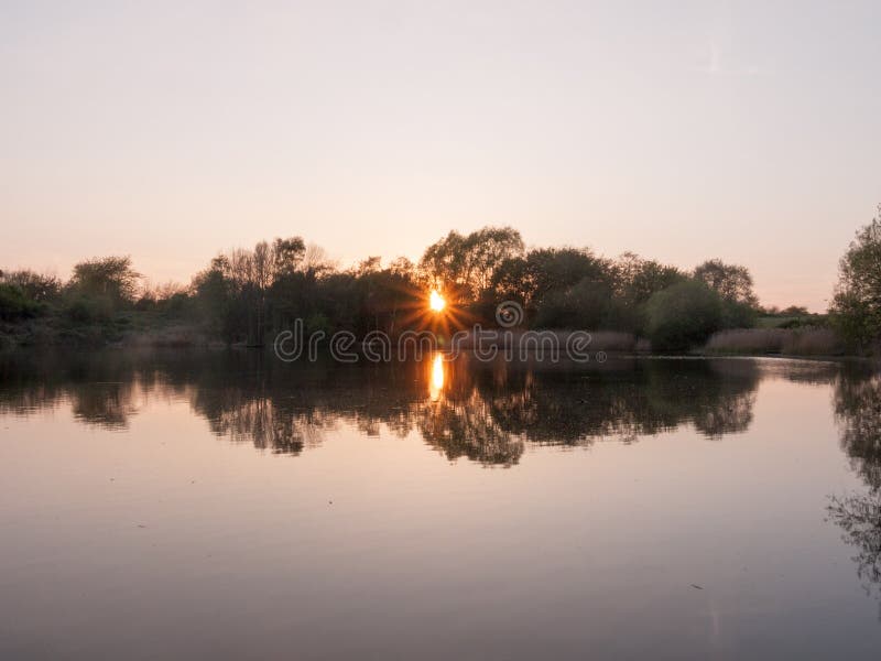 Beautiful Sun Set Over a Lake in Spring with a Sun Globe Stock Image ...