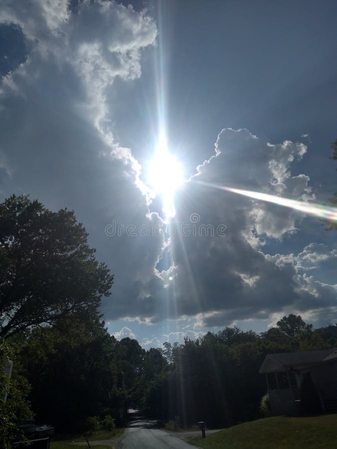 Beautiful Sun Splitting the Clouds Stock Image - Image of tree, cloud ...