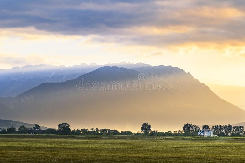 Sunbeams Over Green Hills Landscape by Golden Sky in Australia Stock ...