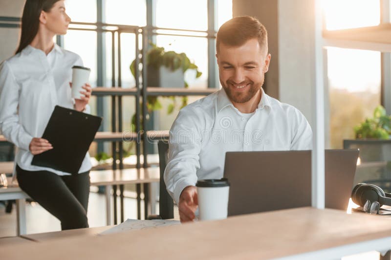 Beautiful Sunlight. Man and Woman are Working in the Modern Office ...