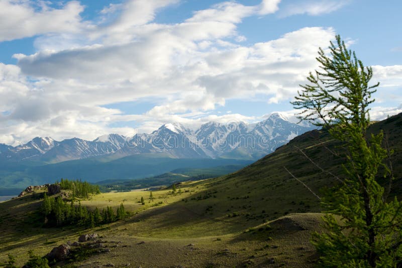 Beautiful Sunny Valley between Mountains with Lush Clouds Stock Photo ...