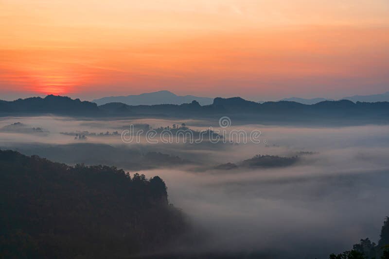 Beautiful Sunrise and Colorful Sky in the Mist Over the Mountain Stock ...