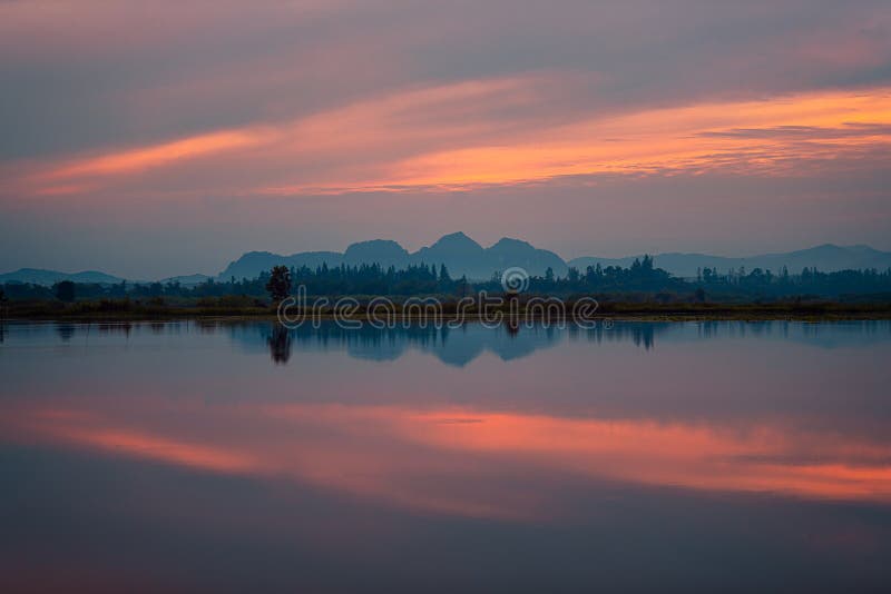 Beautiful Sunrise with Red Sky and Reflection in the Lake Stock Photo ...