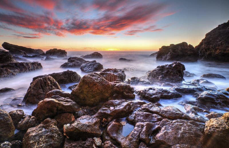 Beautiful Sunrise on Rocky Shore Stock Photo - Image of beautiful ...