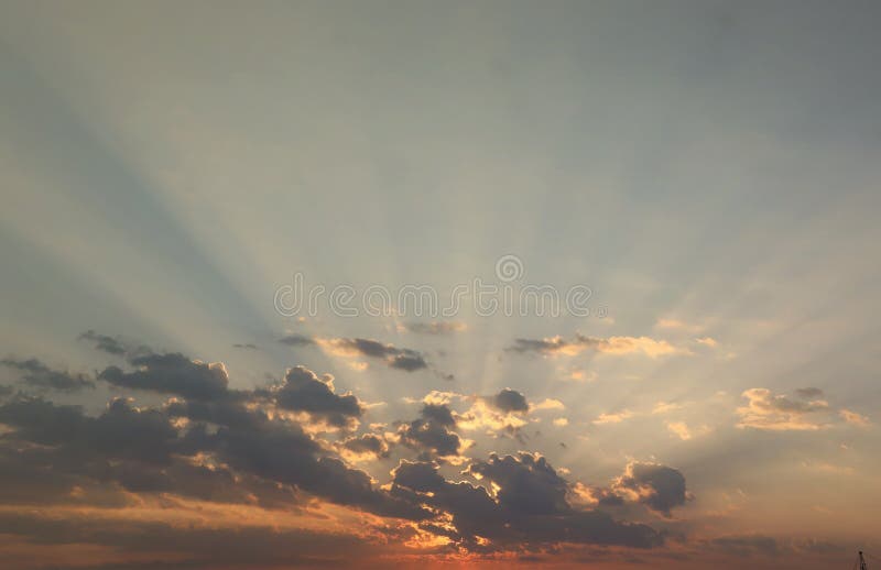 Beautiful Sunrise with Warm Orange Sunlight and Beams through Blue Sky ...