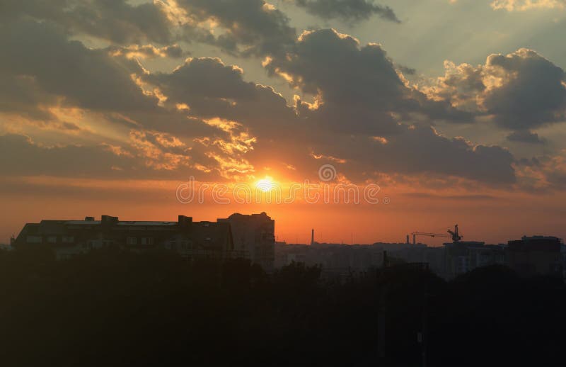 Beautiful Sunrise with Warm Orange Sunlight and Beams through Blue Sky ...