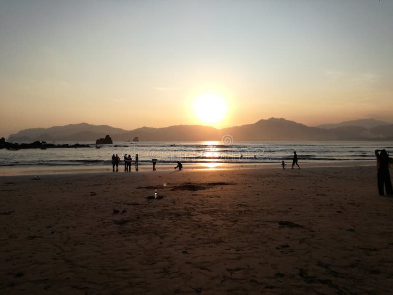 Beautiful Sunset in the Beach with Mountain View and Sunlight Stock ...