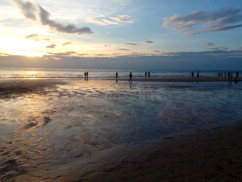 A Beautiful Sunset on the Beach People Walking Stock Photo - Image of ...