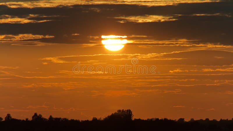 Beautiful Sunset Behind the Clouds Stock Photo - Image of sunset, landscape: 15835294