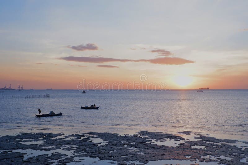 The Beautiful Sunset and Boats on the Middle of the Sea. Stock Image ...