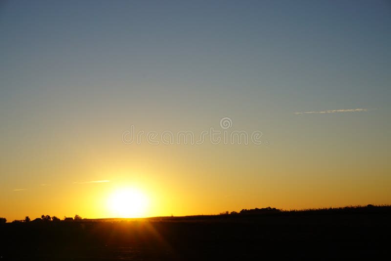 Sunset above the plain. stock image. Image of sunset - 140145183