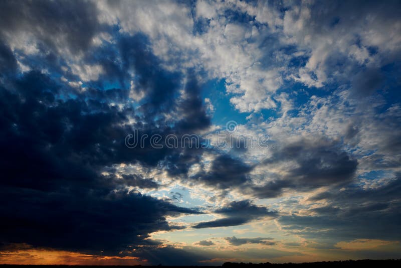 Beautiful Sunset - Dark Sky with Clouds and Sunlight Stock Photo ...