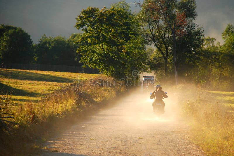 Beautiful Sunset, Dust and Motorcycles Stock Photo - Image of hills ...