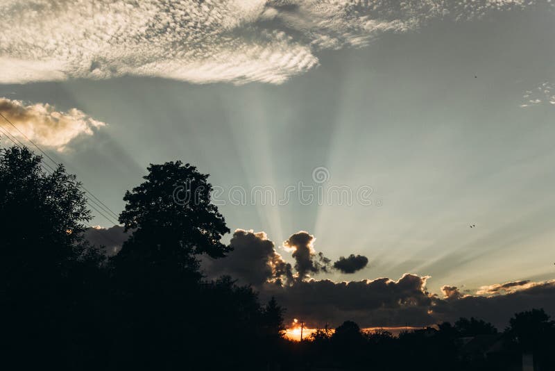 Beautiful Sunset Light Rays through Clouds in Sky in Summer. Atm Stock ...