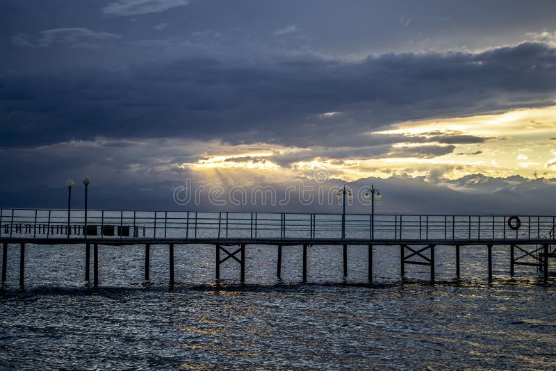 Beautiful Sunset on Mountain Lake with Pier. Stock Image - Image of ...