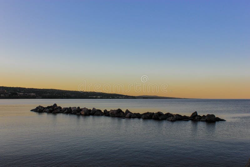 Sunset over Lake Superior stock image. Image of lake - 168317537