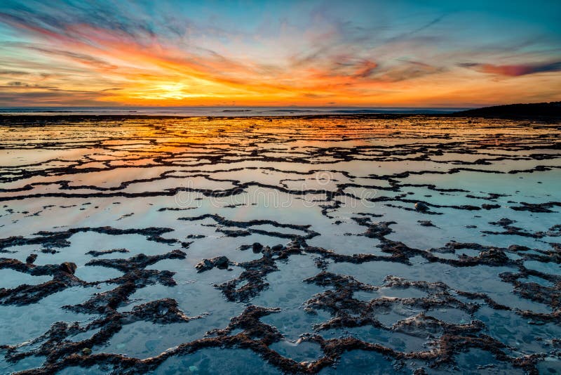 Beautiful Sunset Over the Ocean with Rocky Beach and Tidal Pools in the ...