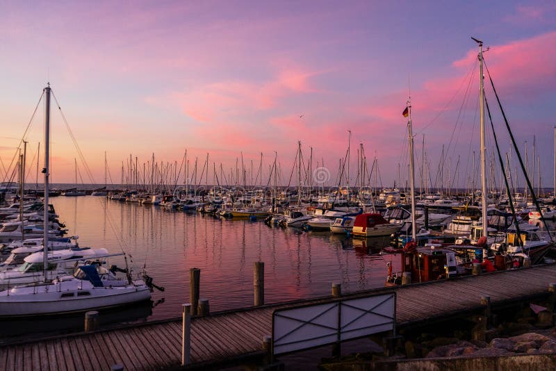 Beautiful Sunset Over a Port with Sailboats and Ships Stock Image ...