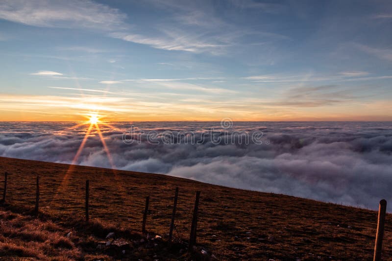 Beautiful Sunset Over a Valley Filled by Fog Stock Photo - Image of ...
