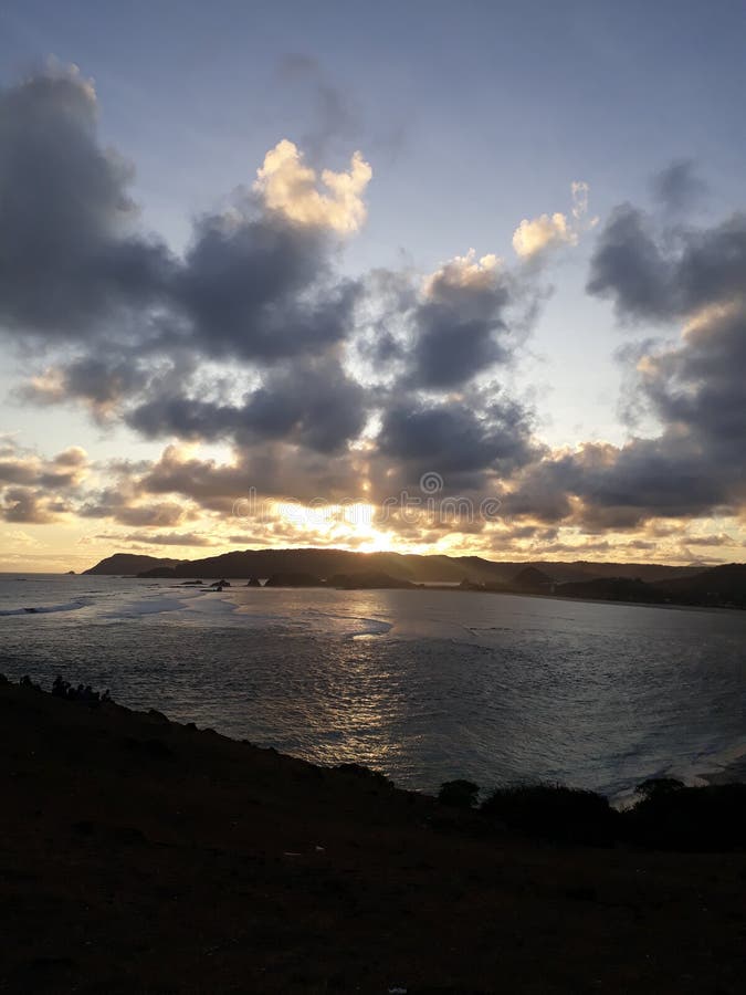 Beautiful Sunset with Overcast Clouds and Lots of Waves Stock Photo ...
