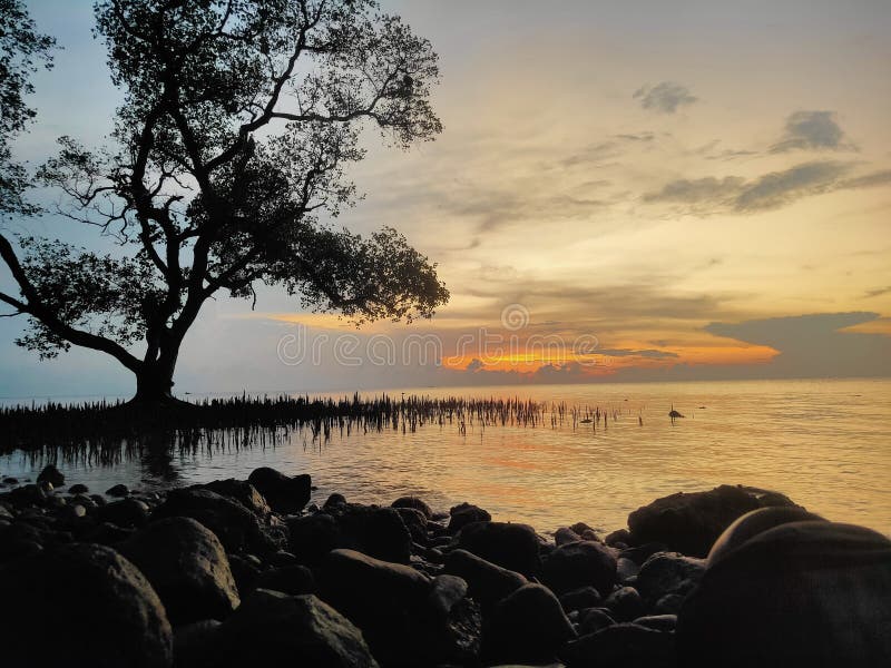 The Beautiful Sunset in Pasir Putih, Indonesia Stock Photo - Image of ...