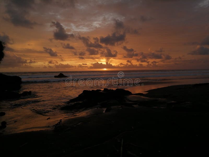 Beautiful Sunset on Peaceful Beach Stock Photo - Image of golden, beach ...