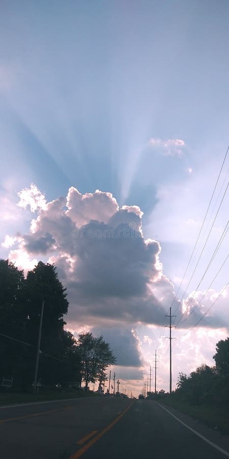 Beautiful Sunset Peaking Behind the Clouds Stock Image - Image of peaking, beautiful: 285359223
