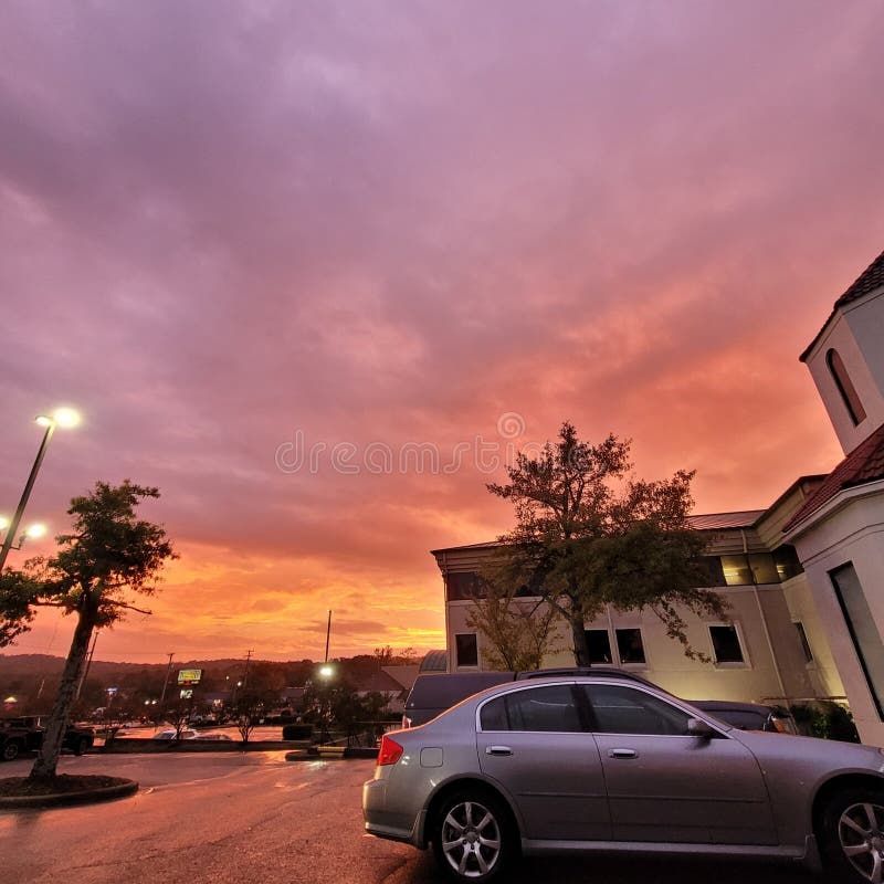 Beautiful Sunset and Reflection on Parking Lot Stock Photo - Image of ...