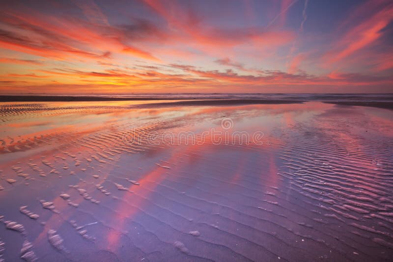 Beautiful Sunset and Reflections on the Beach Stock Photo - Image of ...