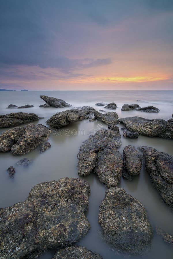 Beautiful Sunset at Rocky Beach Stock Photo - Image of long, clear ...