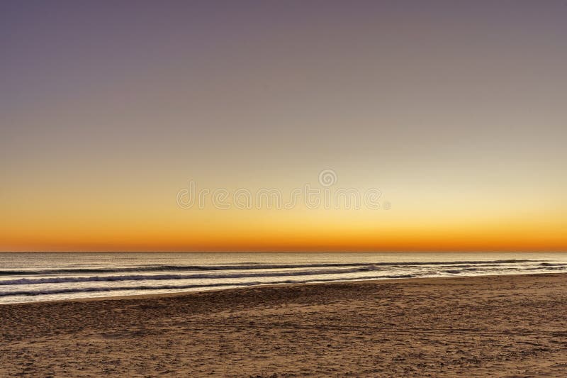 Beautiful Sunset on a Sandy and Calm and Smooth Beach Stock Photo ...