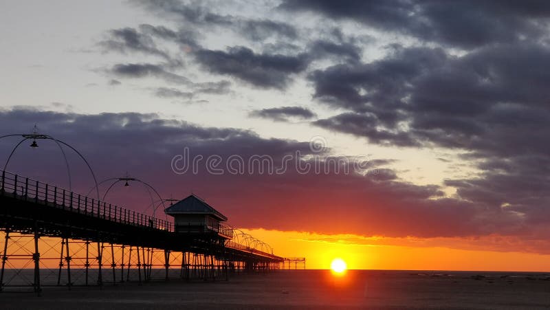 Beautiful Sunset Scene at a Beach with a Pier and a Lifeguard Tower ...