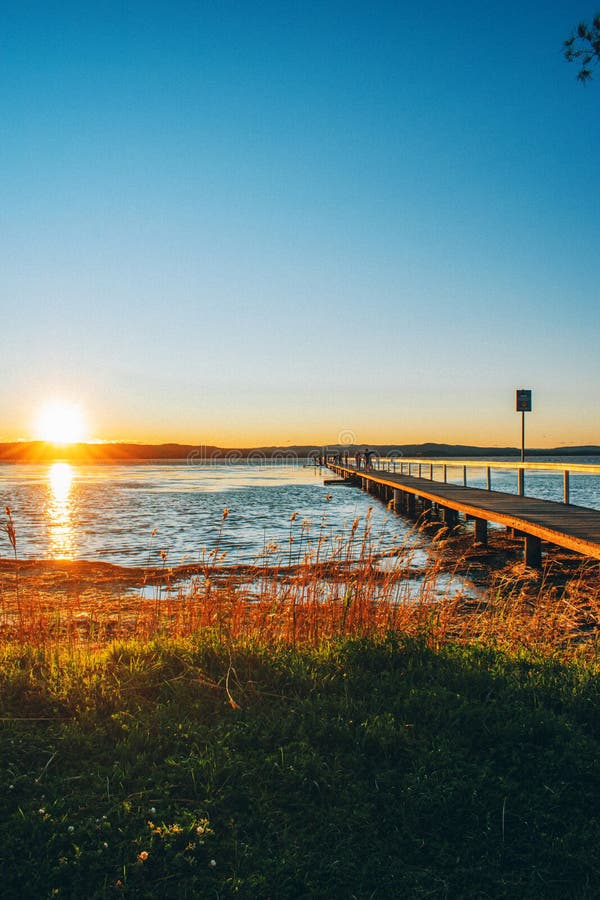 Beautiful Sunset Scenery Over a Pier in a Lake Stock Image - Image of ...