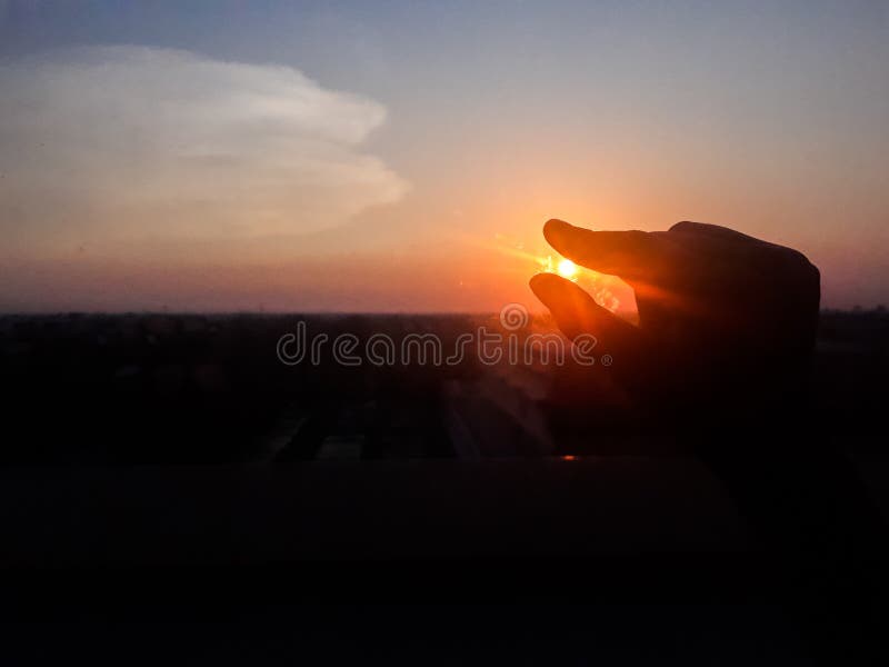 Silhouette touch the sun stock image. Image of finger - 156682845