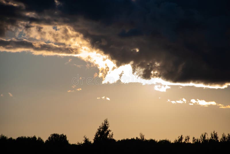 Sunset Sky Against the Backdrop of a Storm Cloud Stock Image - Image of ...