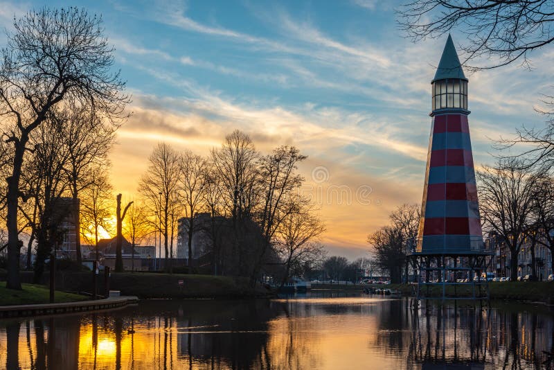 A Beautiful Sunset Sky Behind the Lighthouse Located in Dutch City of ...