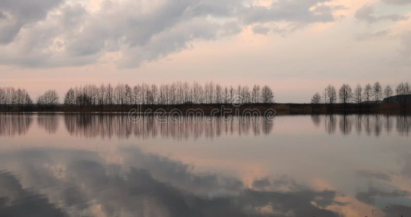 Reflection of the Sky in the Lake at Sunset Stock Video - Video of ...