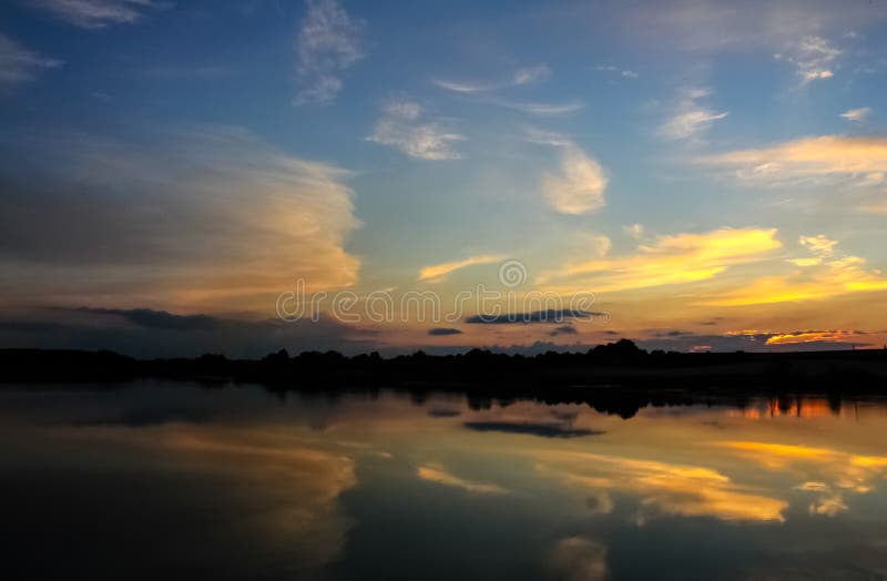 Beautiful Sunset. the Sunset Sky is Reflected in the Water Surface on ...