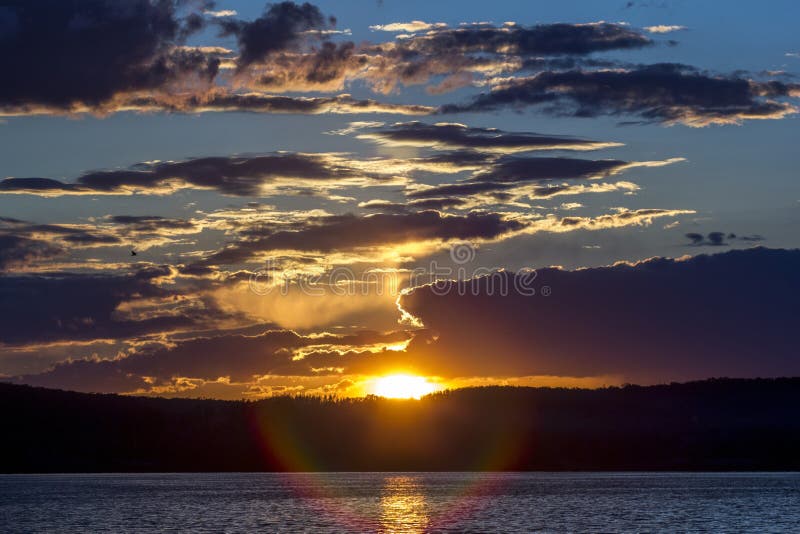 Beautiful Sunset Sky, Reflection of Evening Sun in a Lake Stock Image ...