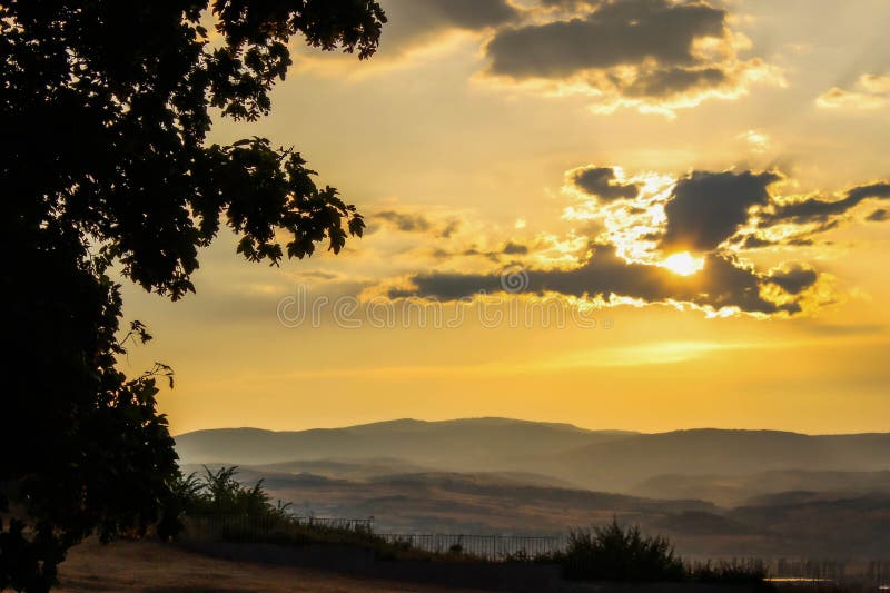 A Sunset with the Sun Rays Shining Stock Image - Image of yellow ...