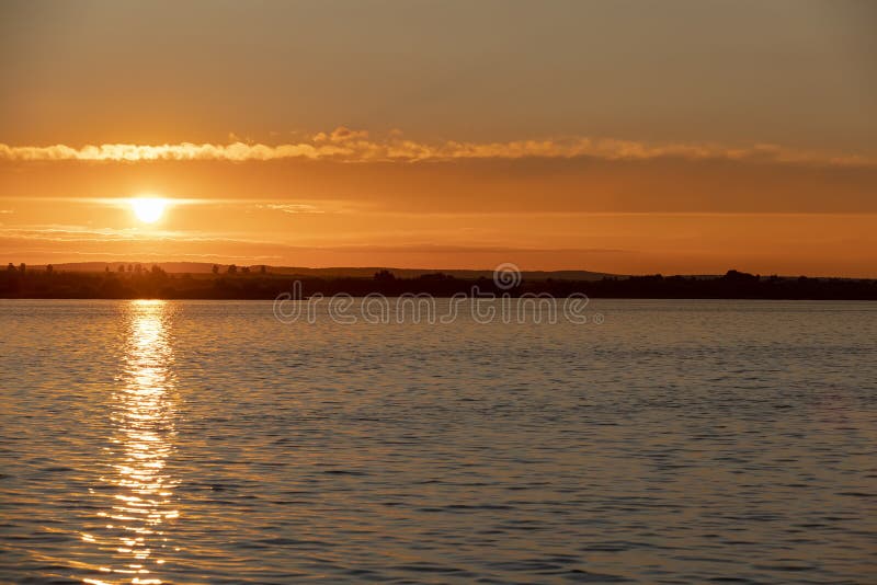 Beautiful Sunset with Sun and Orange Sky on the Lake Stock Photo ...