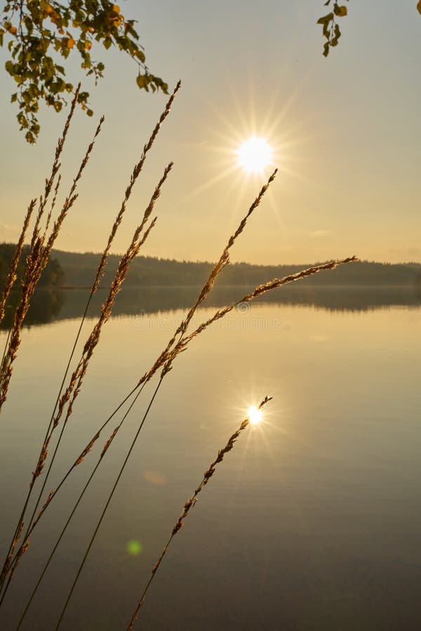 A Beautiful Sunset with Two Suns Reflected in the Lake Stock Photo ...