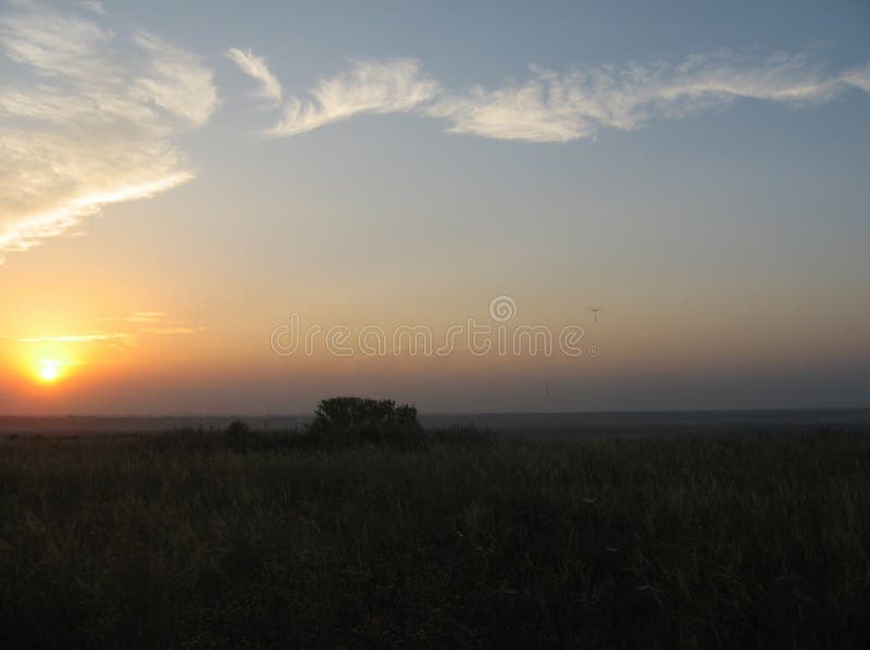 Sunset over the flatland stock photo. Image of evening - 234273152