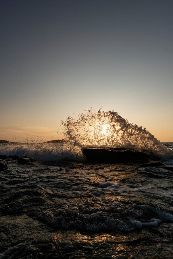 Beautiful Sunset View at a Lake with Splashing Waves Stock Image ...