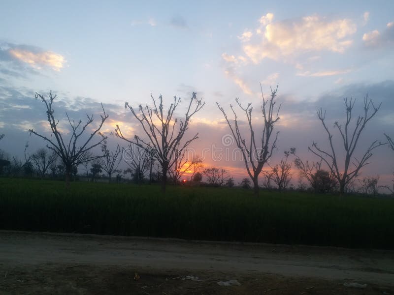 A Beautiful Sunset View on Rural Area Stock Photo - Image of sunset ...