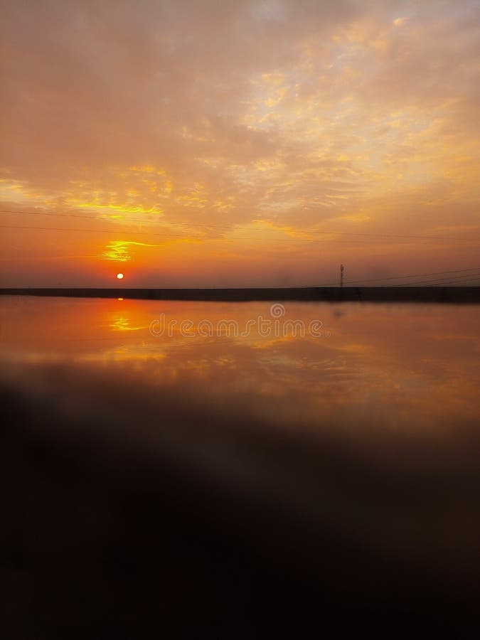 Beautiful Sunsets and Its Reflection in Water Stock Image - Image of ...